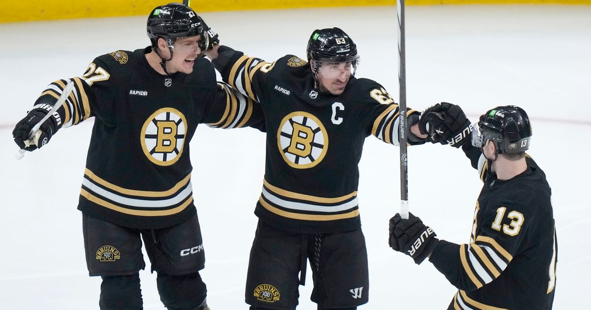 Marchand and Heinen score short-handed, Bruins blank Canucks 4-0 in ...
