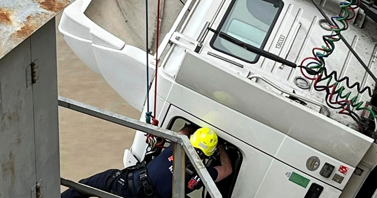 The semi driver rescued dangling from a bridge had been struck by an ...