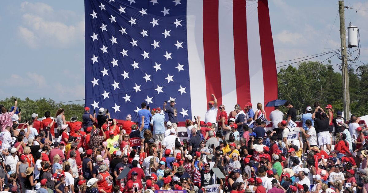 At the Trump rally, it was evening sun, songs and blue sky. Then came ...