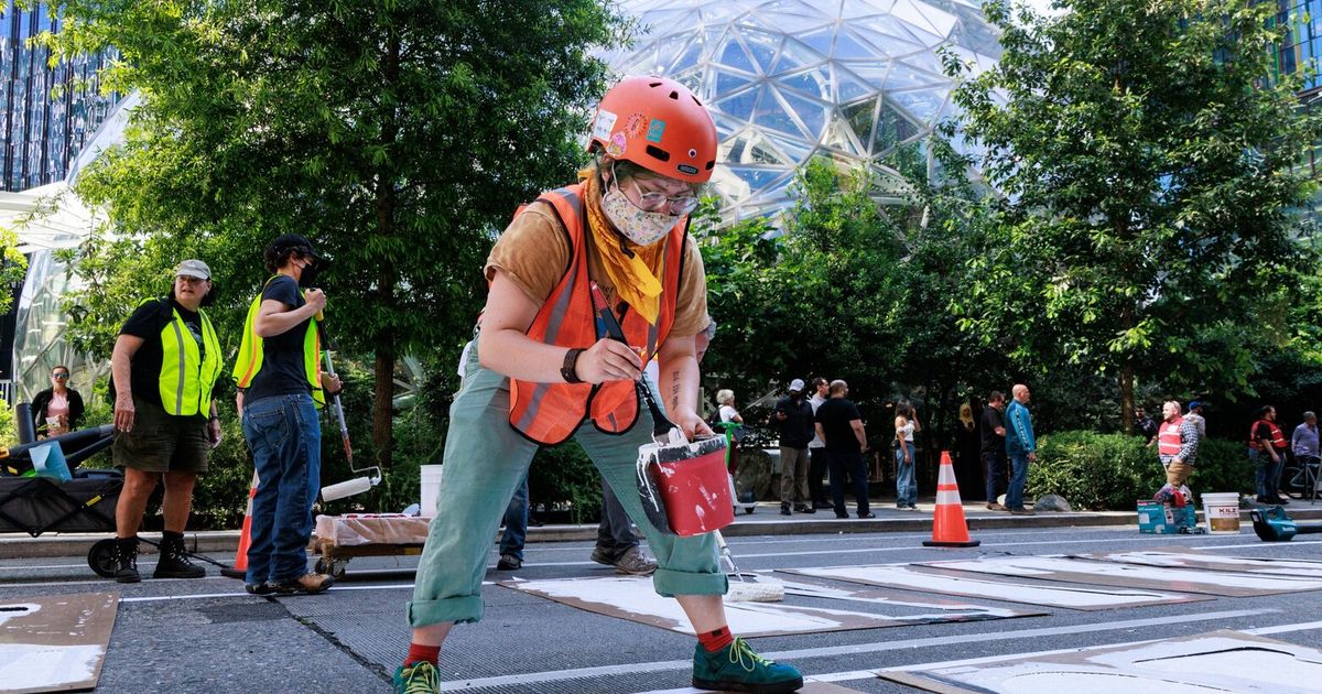 Climate protesters paint Prime Day message to Amazon on Seattle street ...