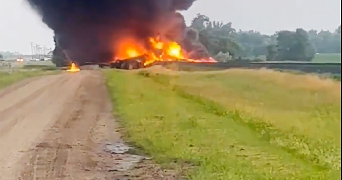 Rail cars carrying hazardous material derail and catch fire in North ...