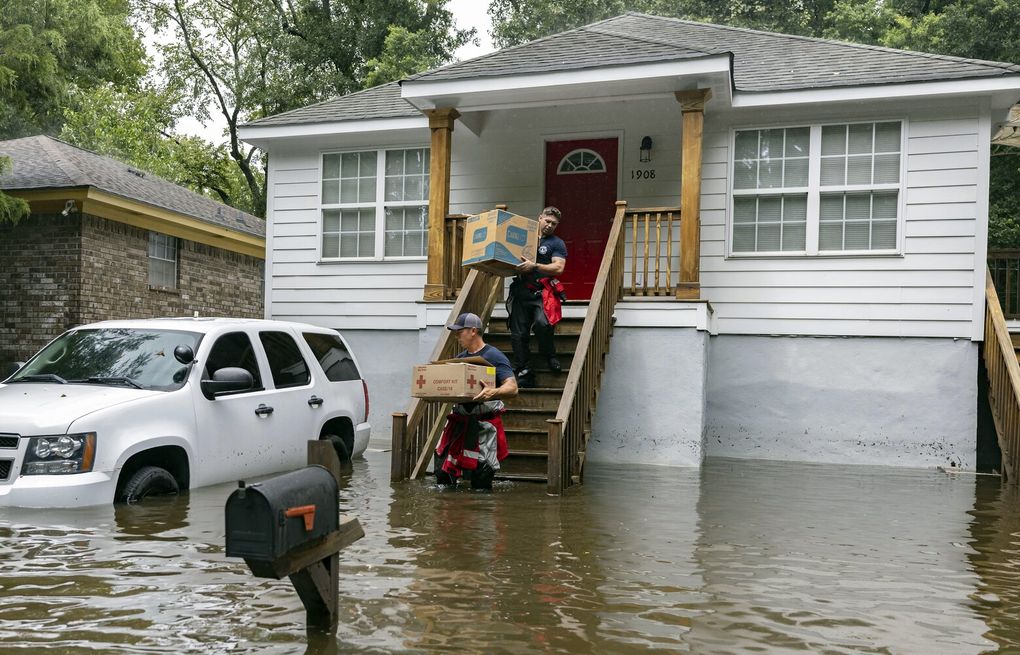 Tropical rains flood homes in an inland Georgia neighborhood for the ...