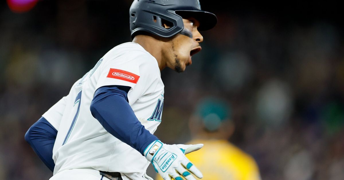 Mariners rally for opening day win over A’s with heroic homers | The ...