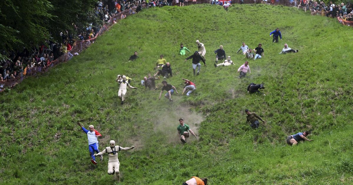 AP PHOTOS: Runners trip, stumble and roll their way to victory in ...