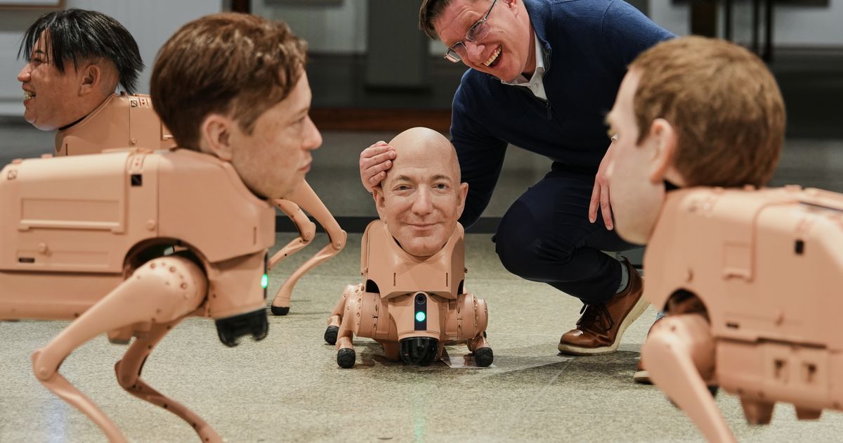 Robot dogs with Musk and Zuckerberg heads roam around Berlin gallery in ...